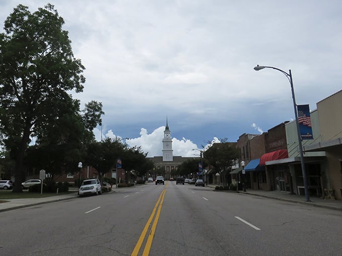 Main Street stretches toward that gorgeous clock tower like a postcard from a friendlier, more affordable era.