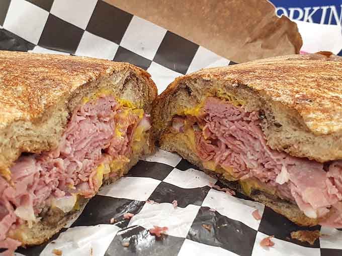 Corned beef gets the royal treatment with melted cheese on rye, golden and glorious from the grill.