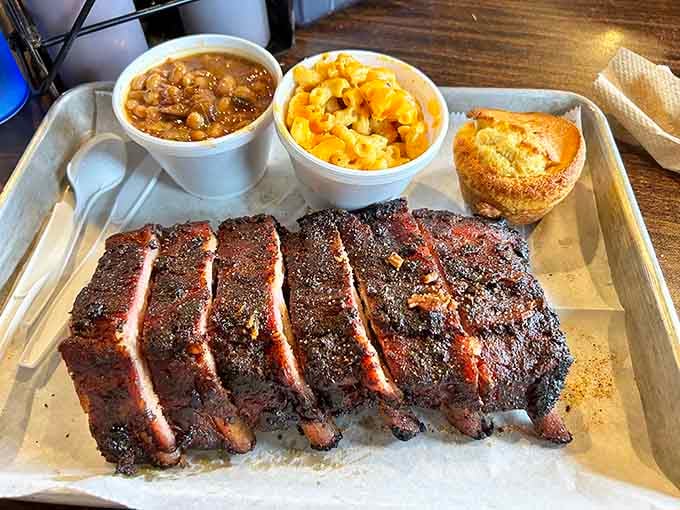 Perfectly sliced ribs flanked by creamy mac and cheese, sweet baked beans, and a golden cornbread muffin of dreams.