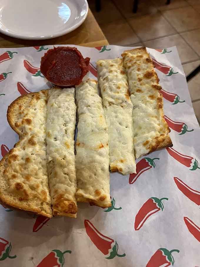 Garlic bread so golden and aromatic, it could make a vampire reconsider their entire lifestyle choice.