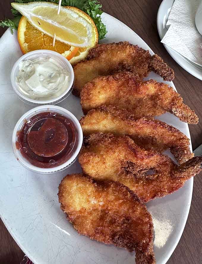 Breaded shrimp with that satisfying crunch that echoes across the dining room, announcing someone ordered wisely.