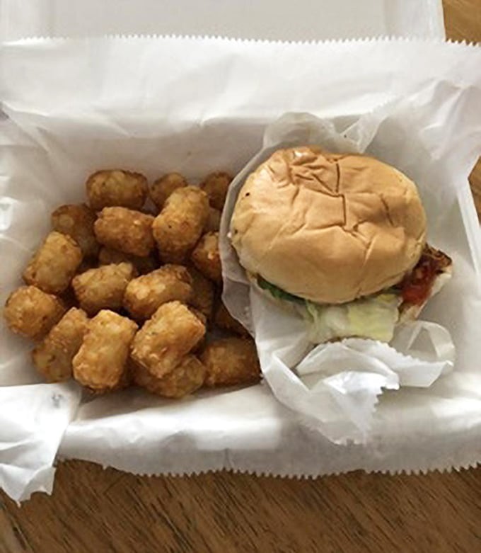 That perfectly assembled cheeseburger with tater tots looks like it could solve most of life's problems in one sitting.