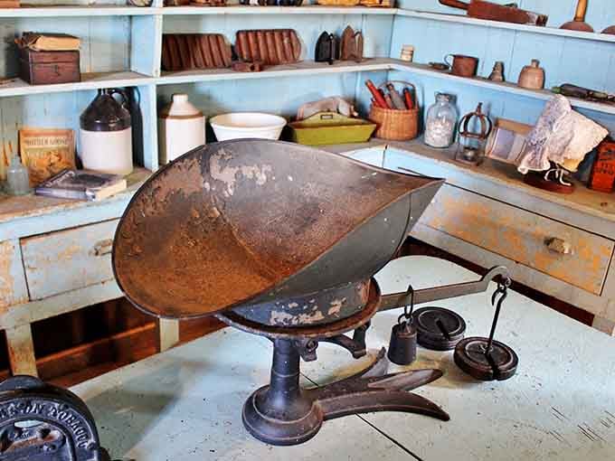 This cast iron scale weighed goods in an era when every transaction carried weight beyond mere commerce.