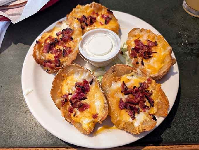 Potato skins topped with bacon and cheese, because sometimes you need your vegetables to come with serious reinforcements.