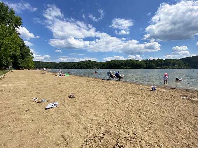 Sandy shores meet clear waters where families splash around like it's their own private lake resort.