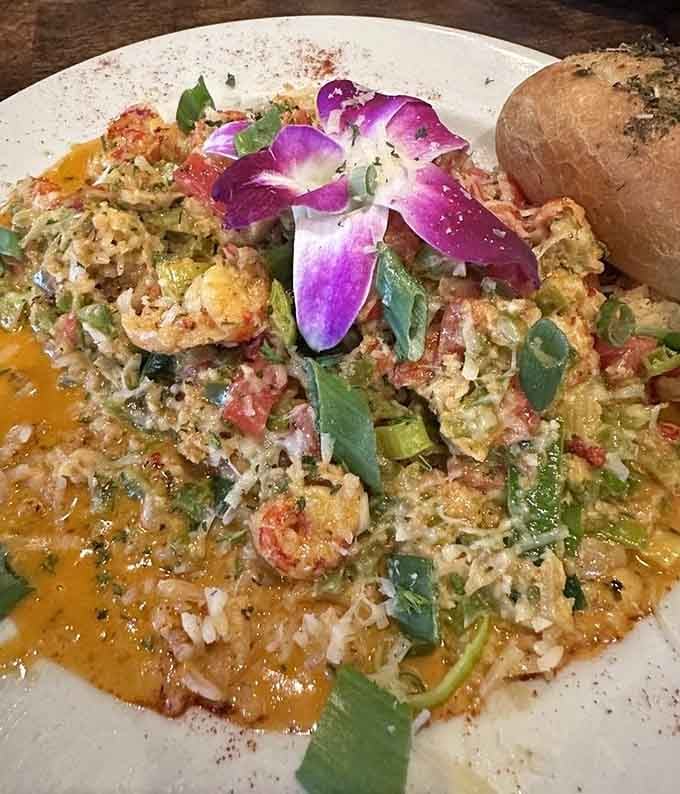 Crawfish Etouffee this beautiful deserves its own Instagram account, complete with that gorgeous orchid garnish adding Louisiana flair.