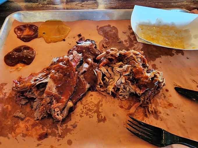 Pulled pork piled high like a delicious mountain, proving that good things come to those who smoke low and slow.