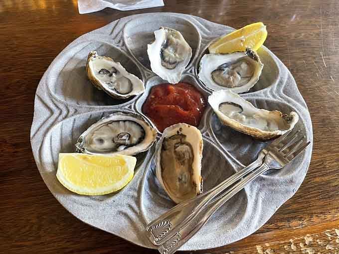 Fresh oysters on the half shell glisten like ocean jewels, each one a briny kiss from the sea.