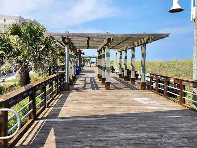 Wooden walkways lead straight to paradise, where sand meets sea and worries dissolve faster than ice cream cones.