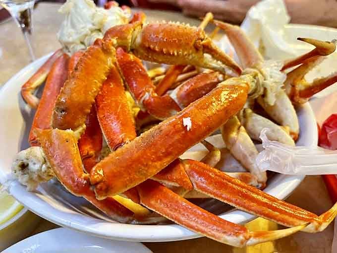 Snow crab legs glistening with butter, ready to test your cracking skills and your napkin supply.