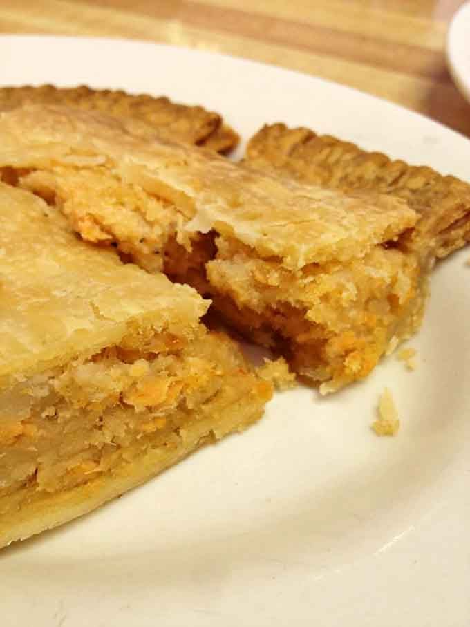 That golden-brown crust promises layers of salmon goodness inside, like a delicious edible treasure chest.