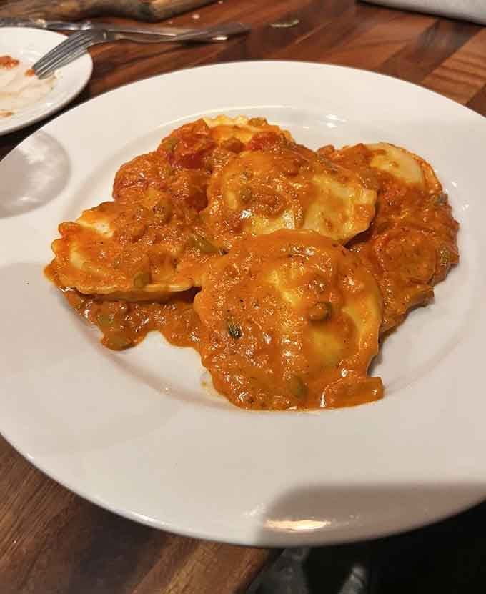 Lobster ravioli swimming in sauce that looks like liquid gold, because sometimes you deserve to feel fancy.