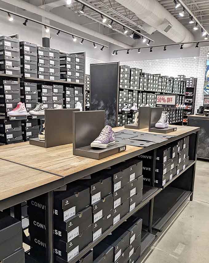 Sneaker paradise stretches before you with that glorious 50% off sign, making shoe addiction suddenly seem financially responsible and medically necessary.