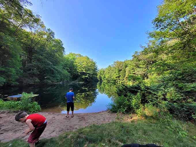 Two humans discovering that skipping rocks beats scrolling through social media any day of the week.