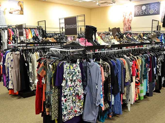Rows of dresses organized like a well-planned dinner party, each one ready for its moment.