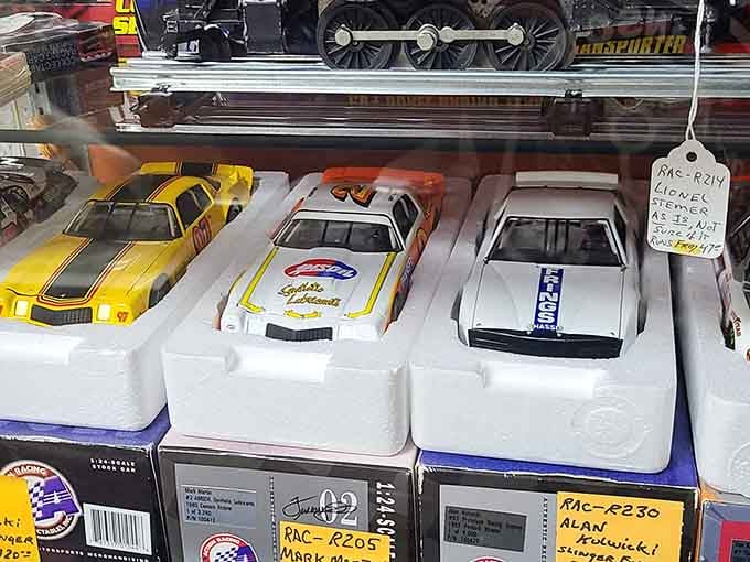 Collectible racing cars lined up like a miniature NASCAR pit row&mdash;your inner child is already reaching for them.