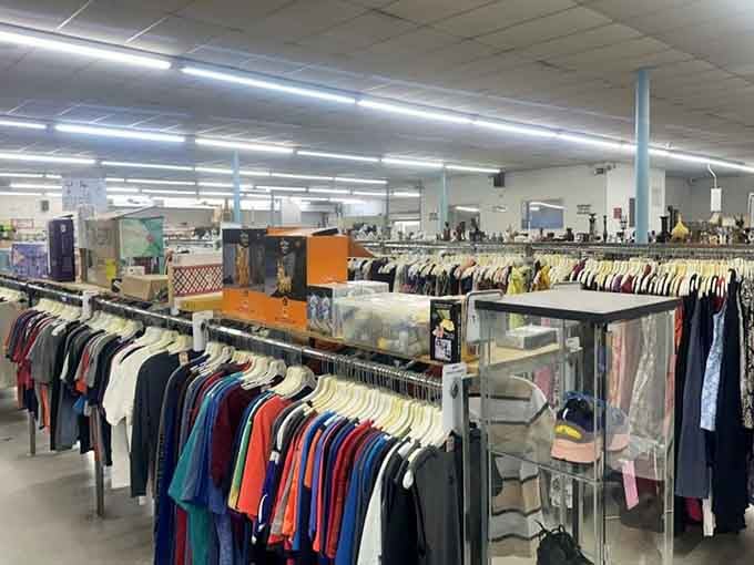 Endless racks create a shopper's maze where designer labels hide among everyday basics waiting for discovery.