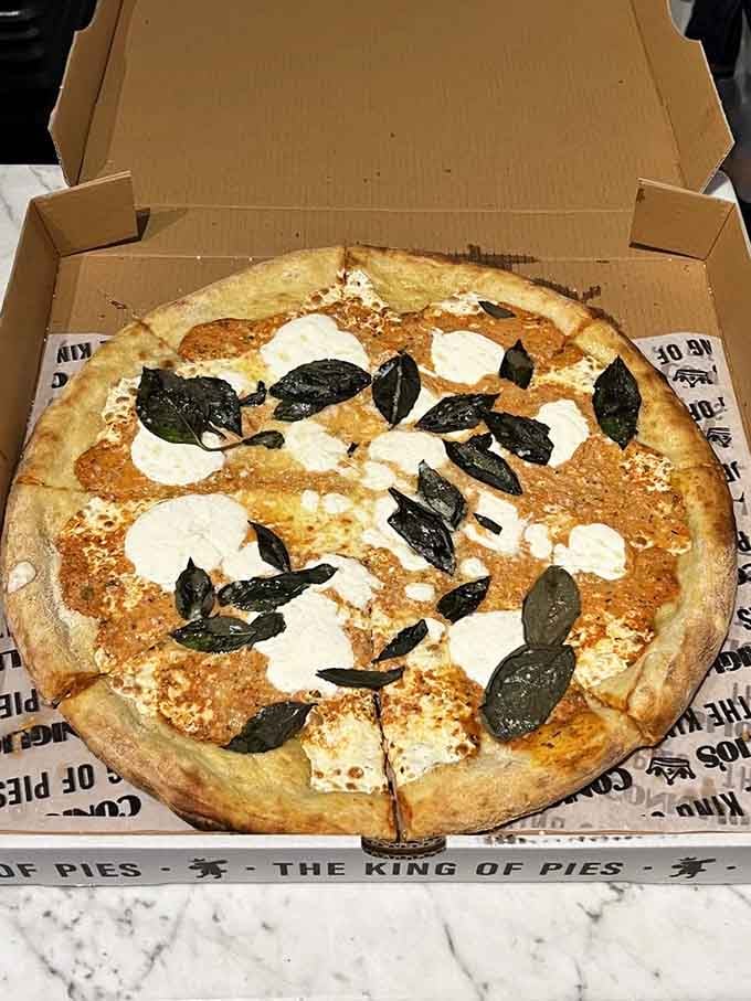 Vodka sauce meets fresh mozzarella on this beauty, proving innovation and tradition can absolutely coexist peacefully.