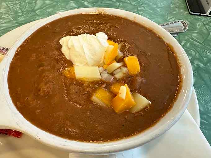 This isn't your average chili; it's a warm hug in a bowl, topped with cheese and possibilities.