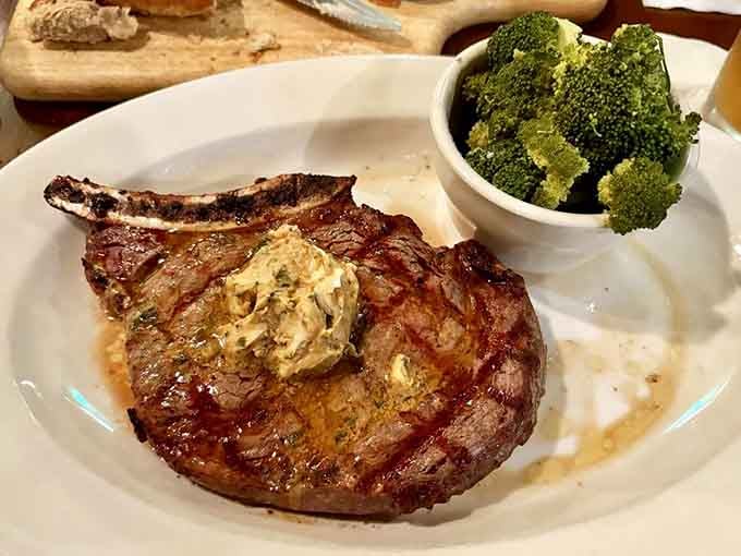 This ribeye topped with herb butter and fresh broccoli is what steak dreams are made of, folks.