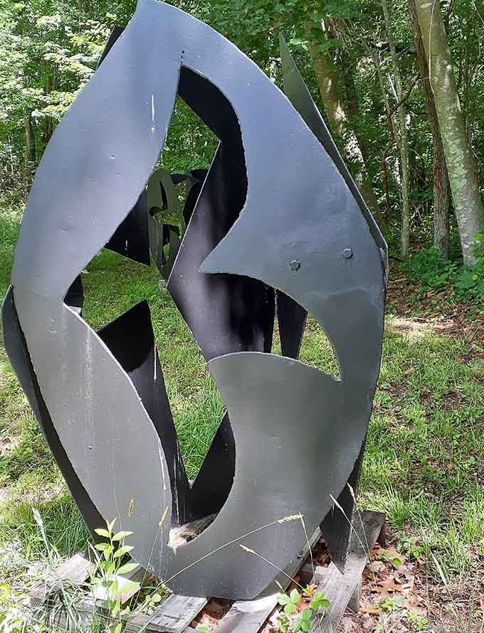 Crafted with precision, this intricate metal work showcases impressive artistry, adding a touch of sophisticated charm to the woodland path.