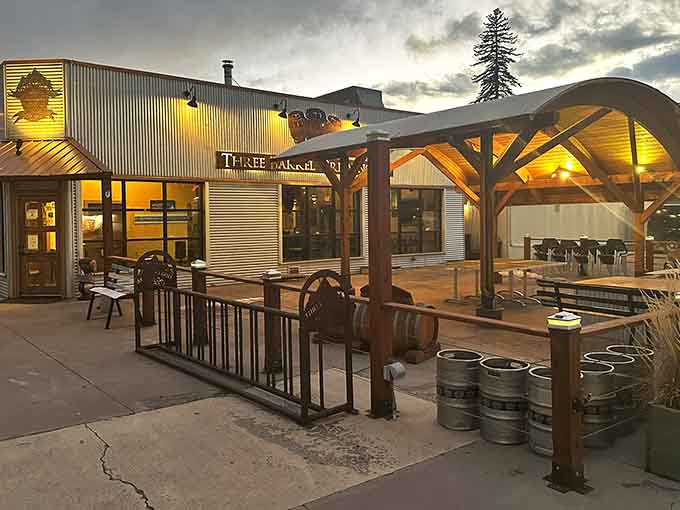 Three Barrel Brewing Co.'s outdoor setup proves that beer tastes better when mountains provide the backdrop for your pint.