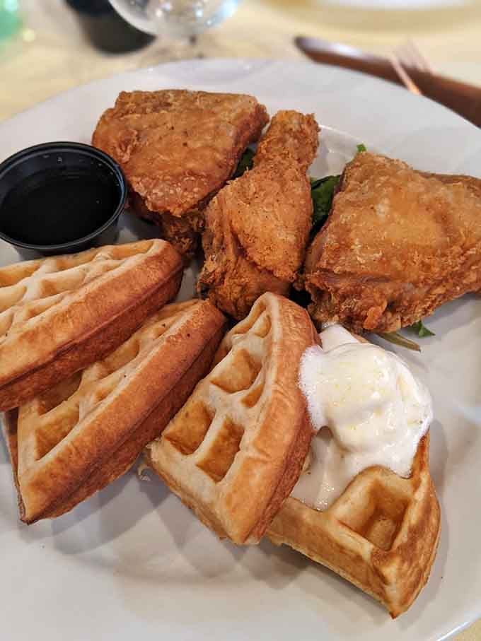 The holy trinity of Southern brunch: perfectly fried chicken, fluffy waffles, and syrup ready for its starring role.