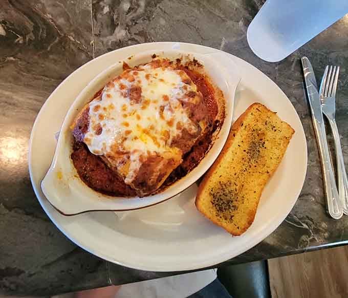 Bubbling lasagna with garlic bread is the kind of Italian comfort that makes everything right with the world again.