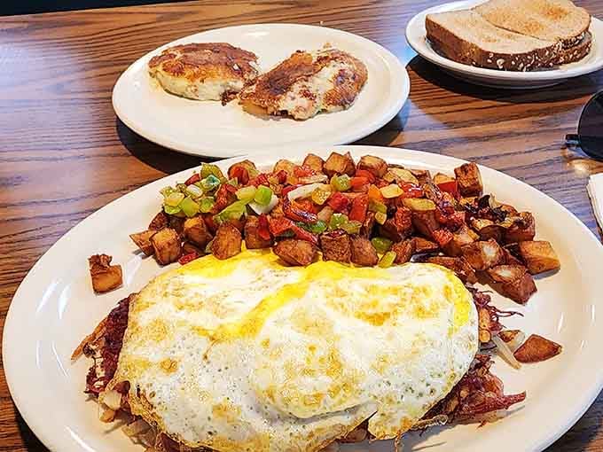 Corned beef hash topped with sunny eggs and a mountain of breakfast potatoes screams comfort.