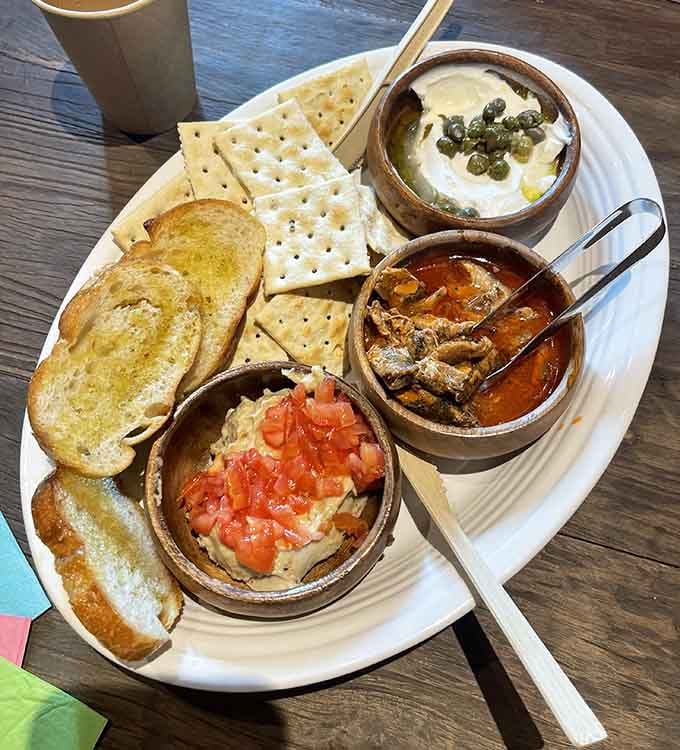 Crackers, toast, and three dips transform wine tasting into a proper meal without requiring actual cooking skills.