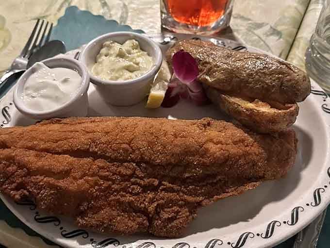 Golden walleye fillets that honor Wisconsin's fishing heritage, one perfectly crispy bite at a time for lucky diners.