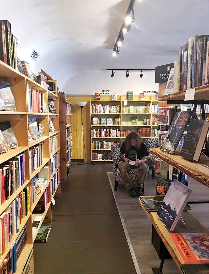 Someone's found the ideal spot, completely absorbed in their book while the world quietly passes by.