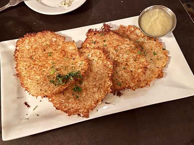Potato pancakes so crispy they could double as edible frisbees, served with applesauce and sour cream for dipping.