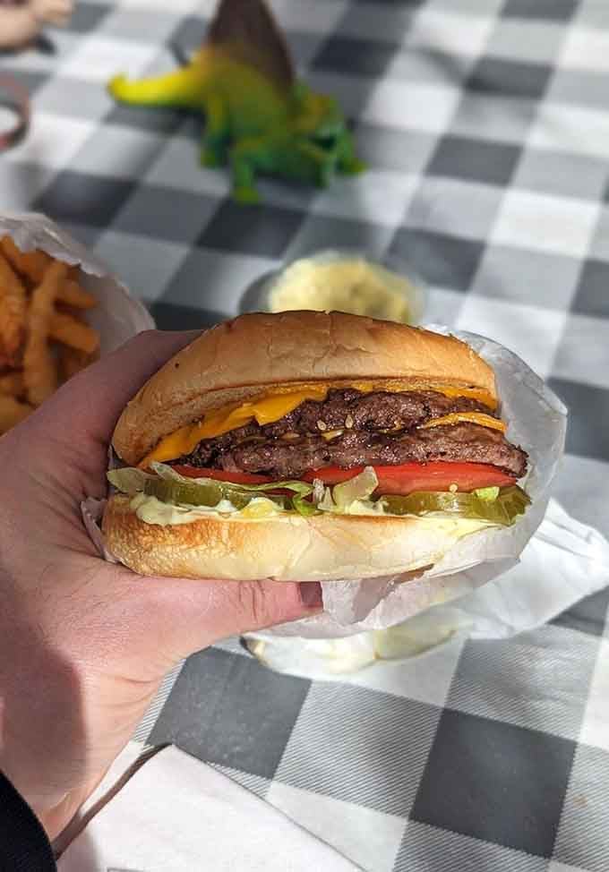 The Big Tom arrives like a delicious skyscraper, making architectural history one bite at a time.