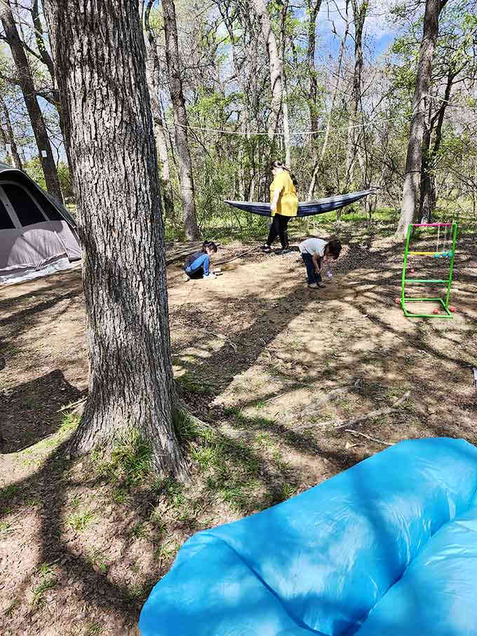 Family camping done right: hammocks, ladder ball, and enough space to actually enjoy each other's company without tripping over tents.