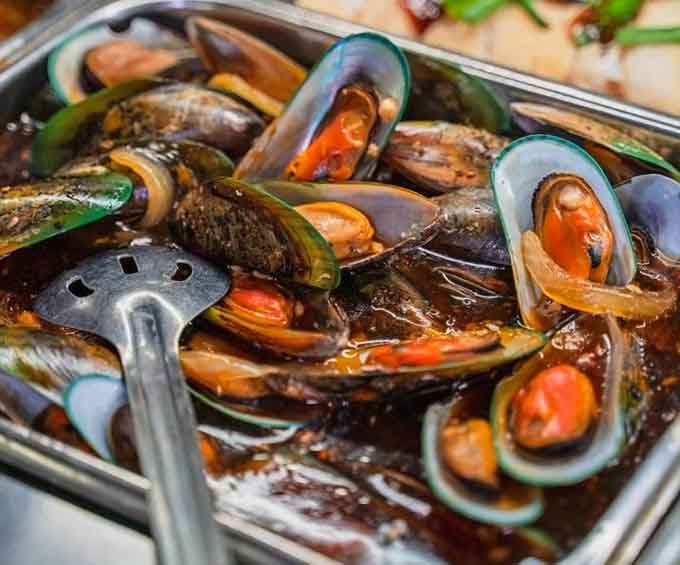 Mussels glistening with garlic and herbs, bringing a taste of the coast to Central Florida.
