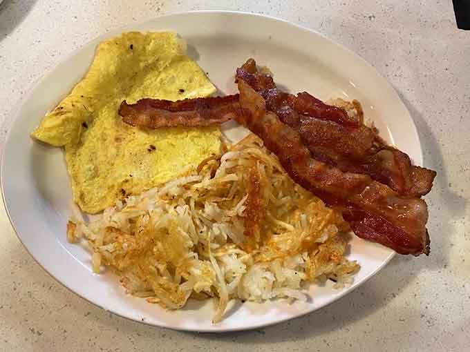 The classic trio &ndash; eggs, bacon, and hash browns &ndash; executed with the precision of a symphony.