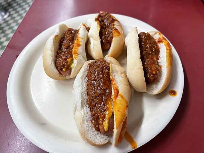 That proprietary meat sauce cascading over these mini franks has inspired more recipe speculation than Colonel Sanders' eleven herbs and spices.