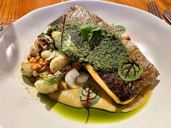Crispy-skinned trout plated like edible art, because your dinner should look as good as it tastes.