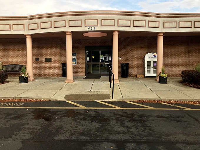 The library entrance welcomes readers with columns that say "knowledge matters" louder than any overdue notice ever could.