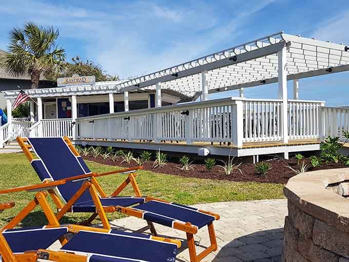 The Sandbar beckons with promises of cold drinks and zero judgment about how much sand you're tracking inside.