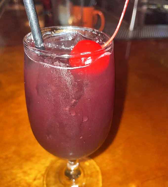 Deep purple sangria topped with a cherry, because nothing says vintage California quite like wine-based nostalgia.
