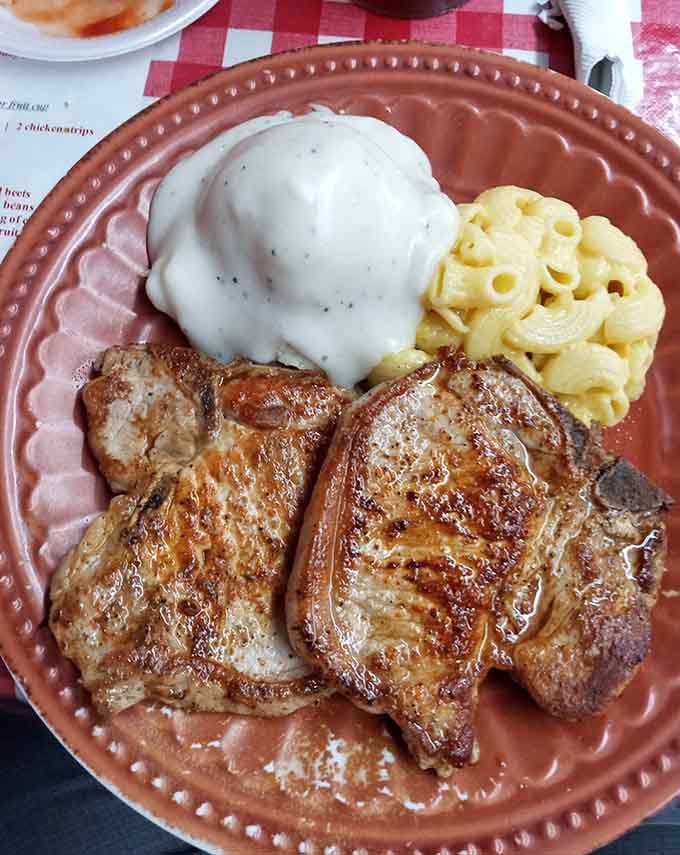 Grilled pork chops with mac and cheese that prove simple done right beats fancy done wrong every time.