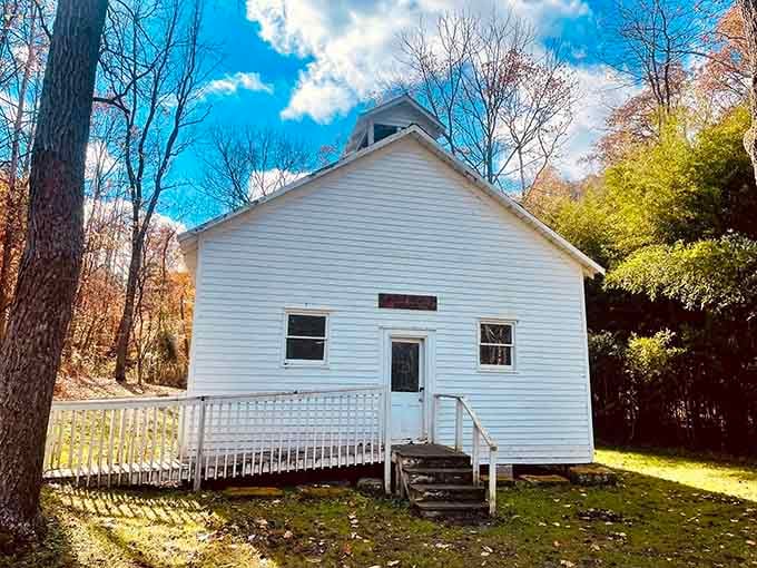 This historic one-room schoolhouse stands white and proud, a charming reminder of simpler educational times gone by.