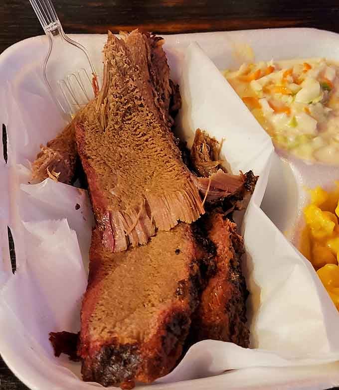 That smoke ring and bark on this brisket would make any pitmaster weep tears of pure joy.
