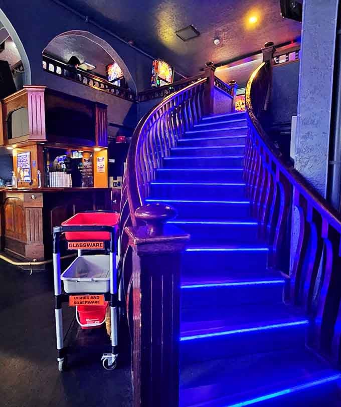 These glowing purple stairs lead to more gaming upstairs, like climbing into your own personal arcade heaven one step at a time.