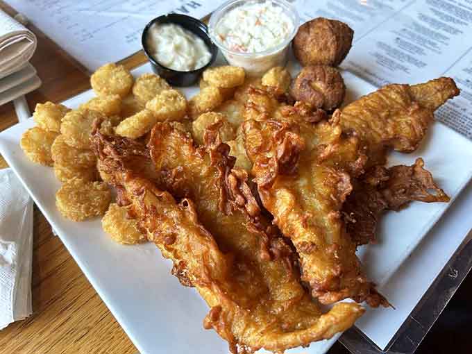 Golden fried fish and shrimp with waffle fries that prove sometimes simple done right beats fancy every time.