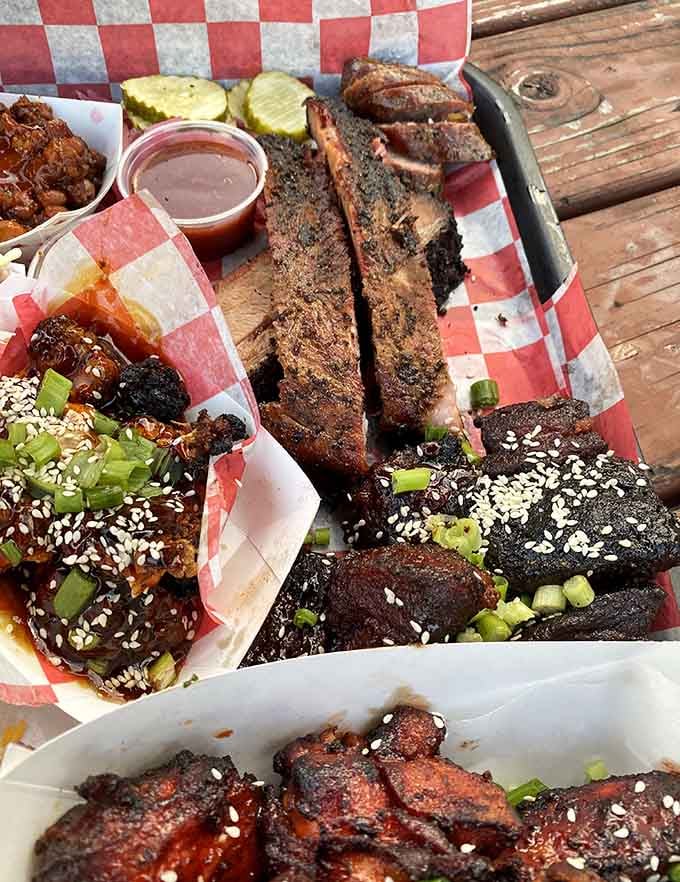 Three meats, multiple sides, and enough flavor to make you forget every diet you've ever attempted.