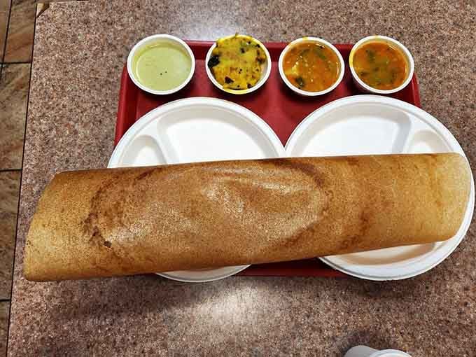 When your dosa arrives looking like edible origami, you know you've found something special worth the trip to Queens.