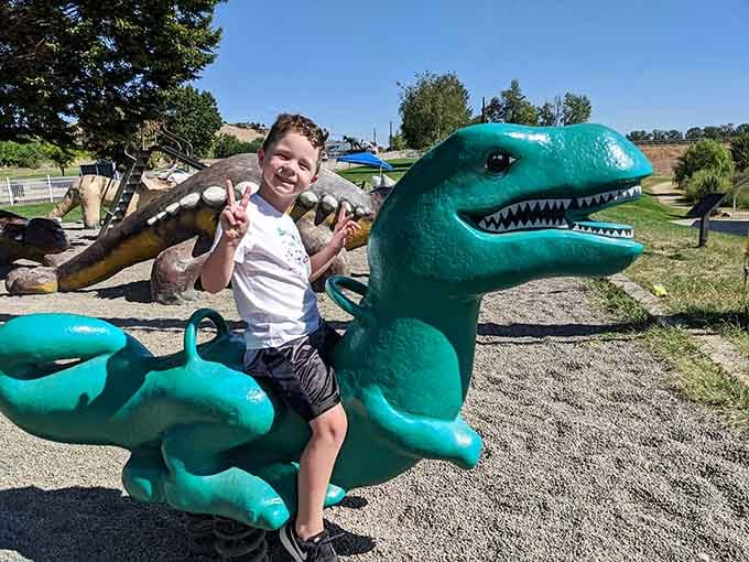 Pure joy captured in concrete and giggles, where every kid becomes a fearless dinosaur wrangler for the afternoon.